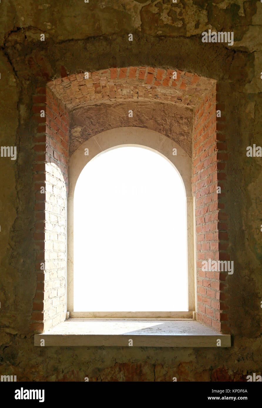 bright window of a ancient fortress with the wall with red bricks Stock ...