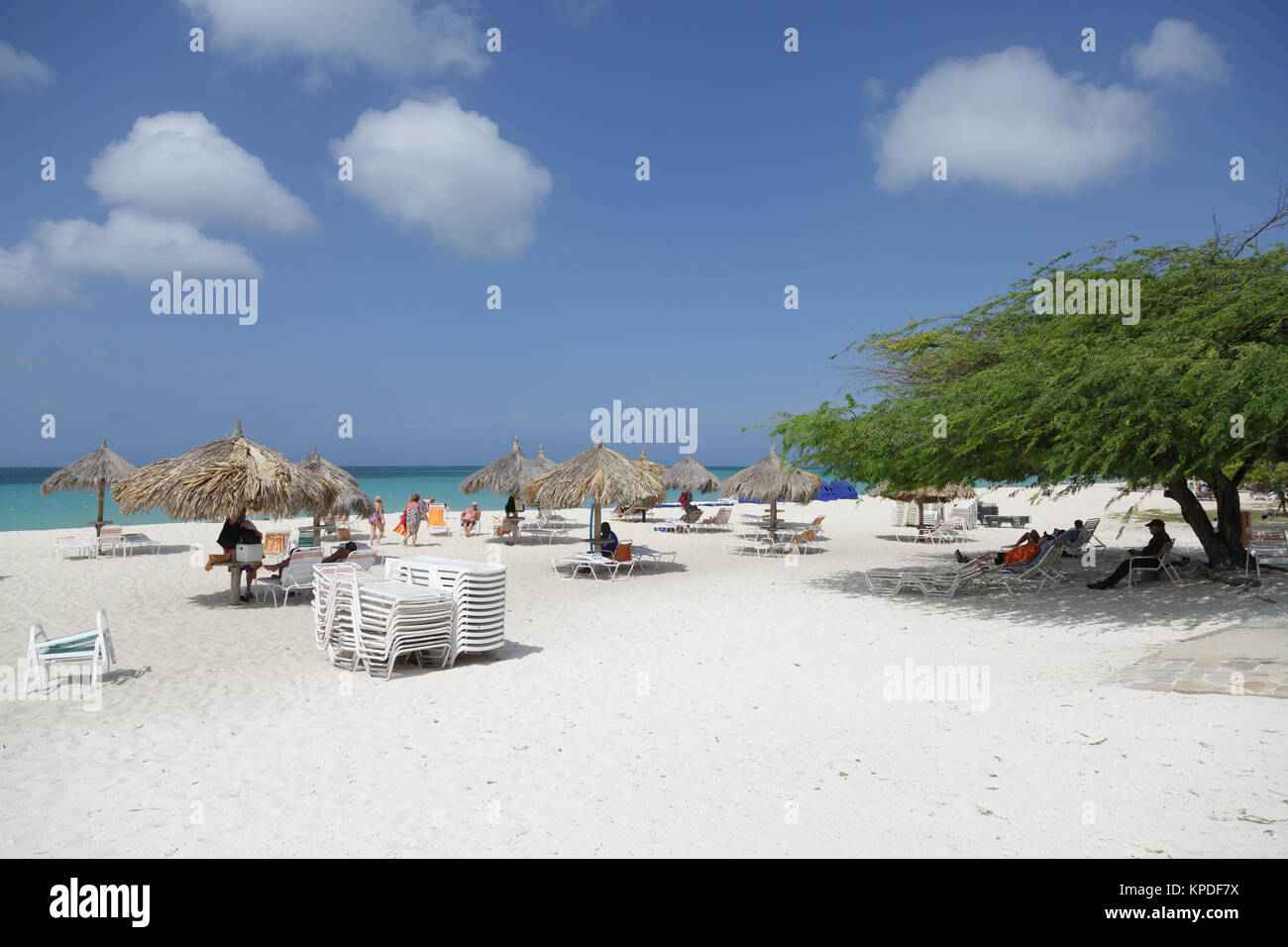 Tourists enjoying a sunny day on the beach of Aruba Stock Photo - Alamy