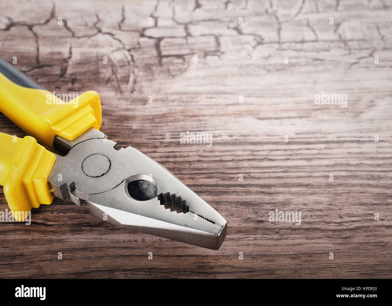 multitool pliers on wooden background Stock Photo - Alamy