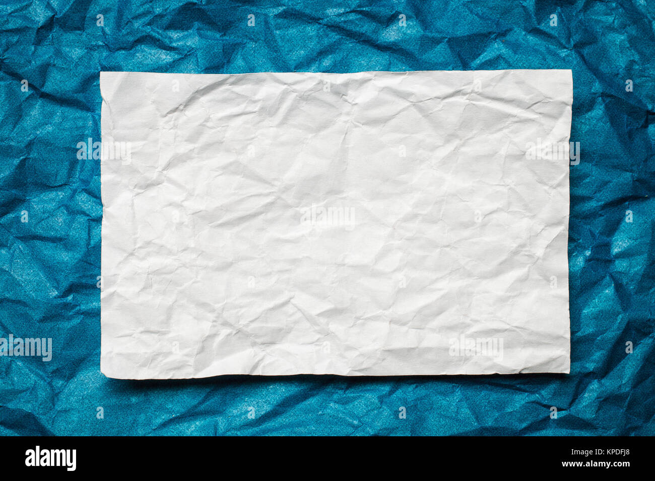 paper card on blue background Stock Photo - Alamy