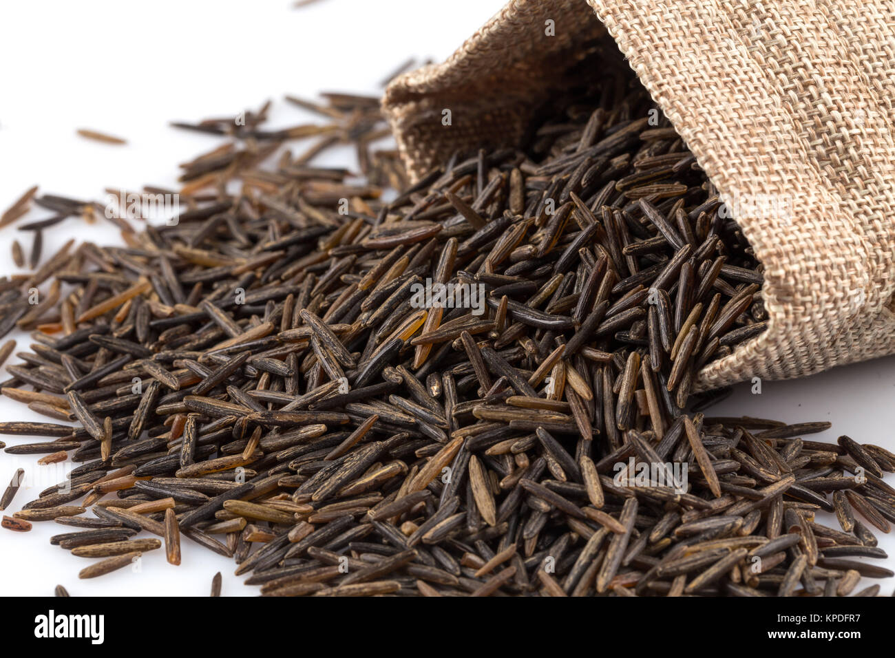 Heap of wild rice on white background Stock Photo - Alamy