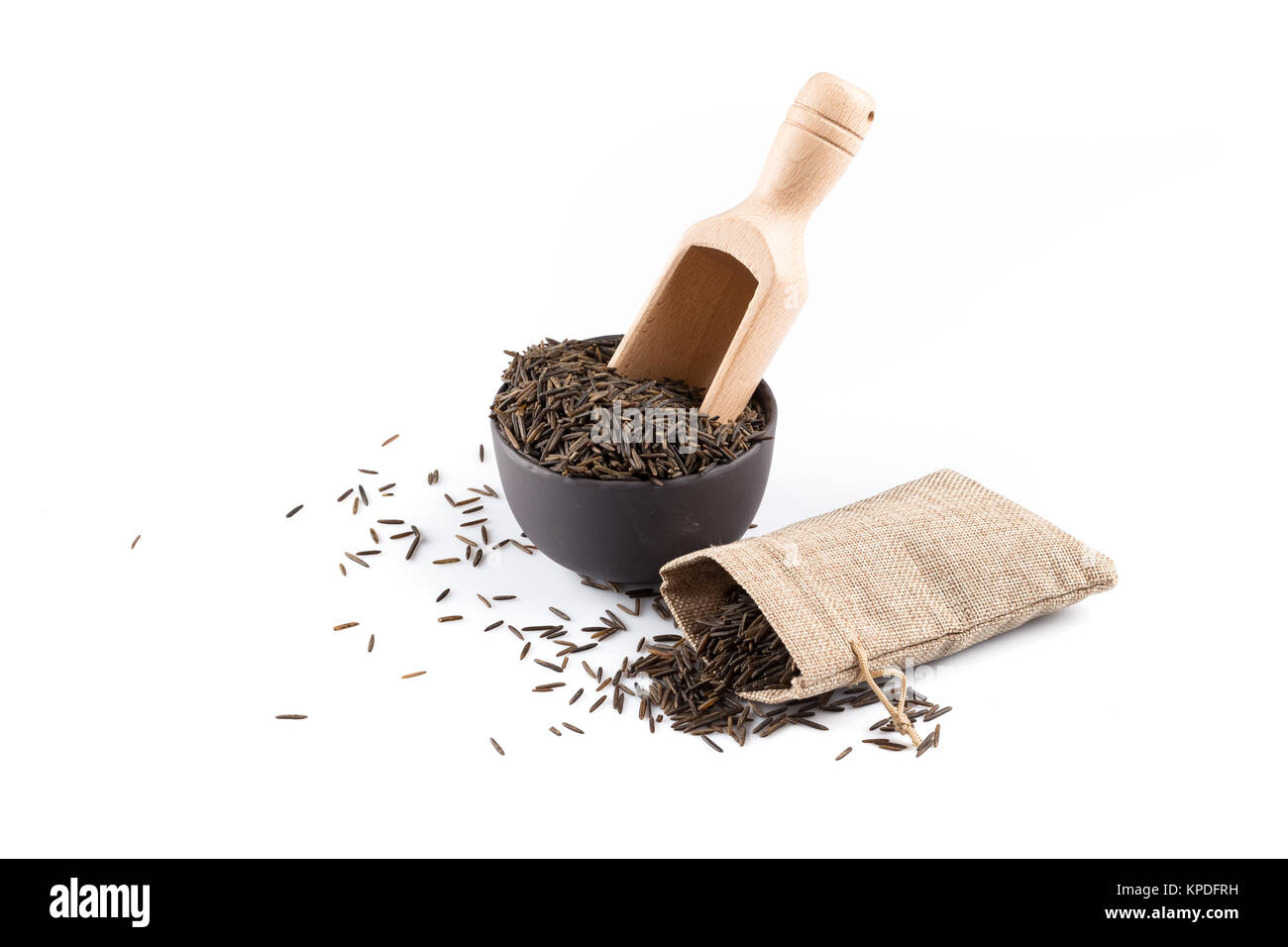 Wild brown rice in spoon Stock Photo - Alamy
