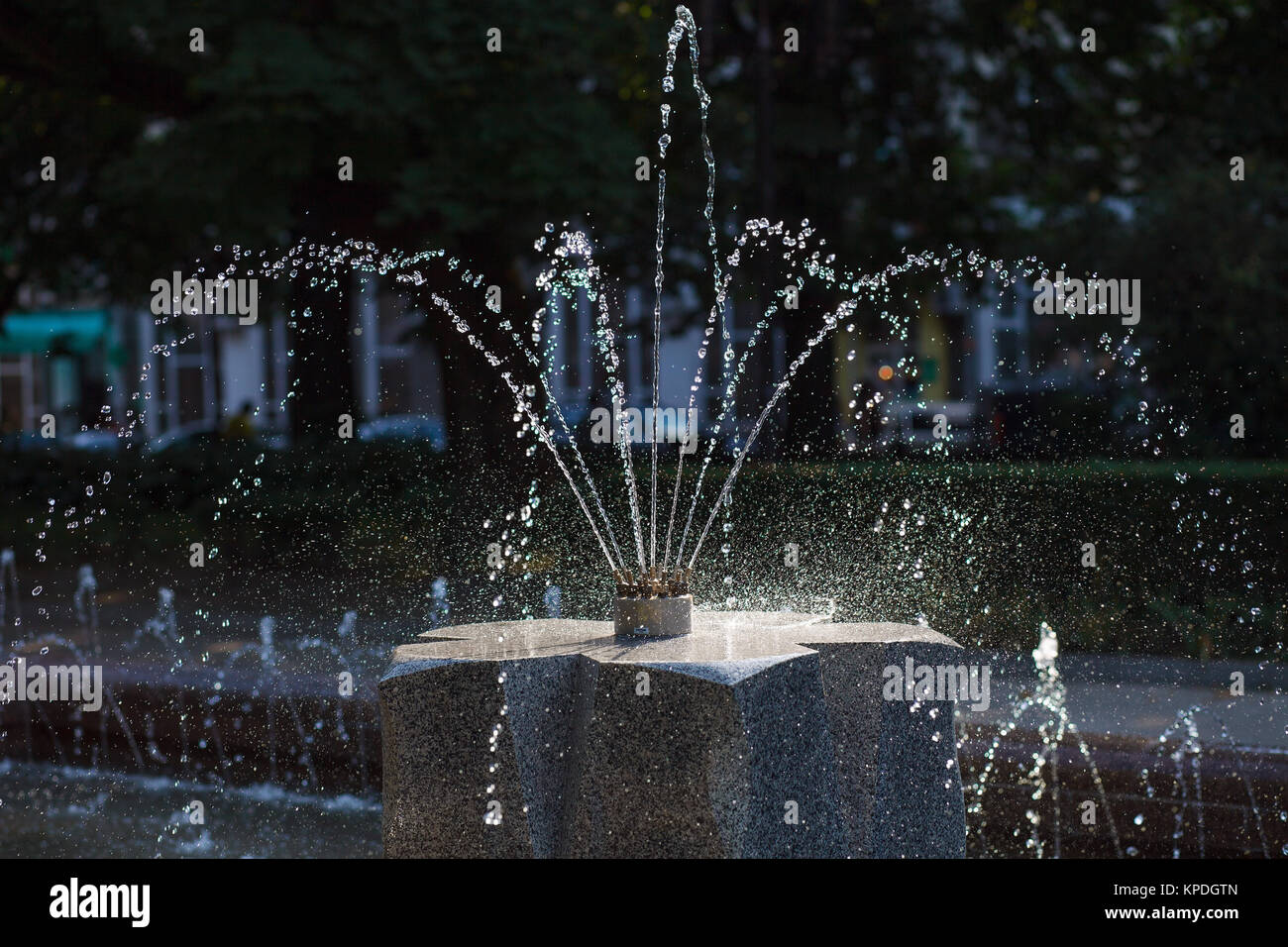 Water stream splashing on ground Stock Photo - Alamy
