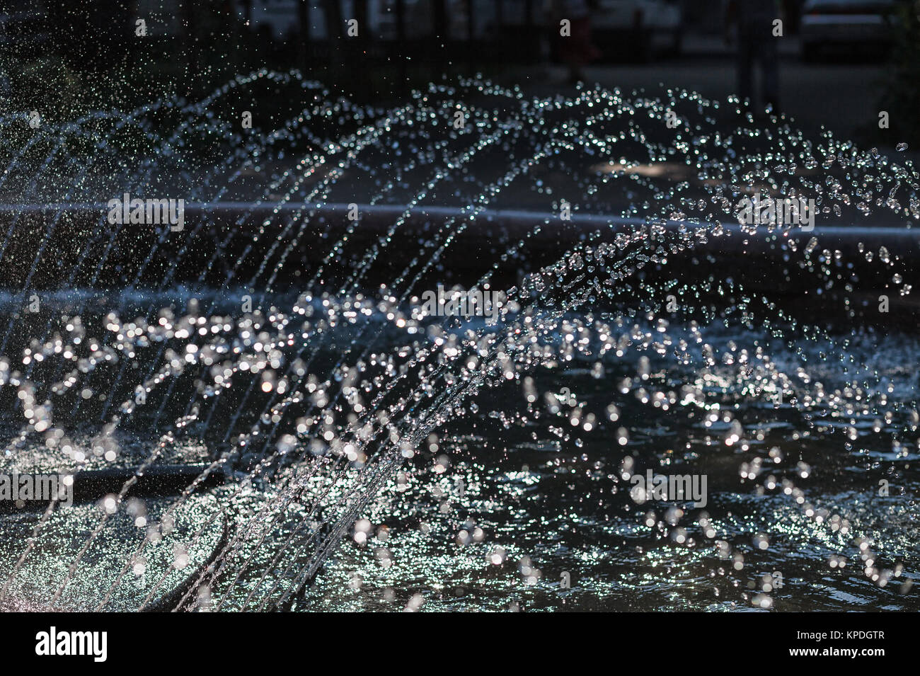 Water stream splashing on ground Stock Photo - Alamy