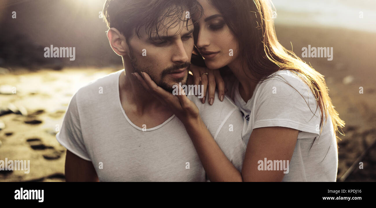 Portrait of a couple - wife hugging her handsome husband Stock Photo ...