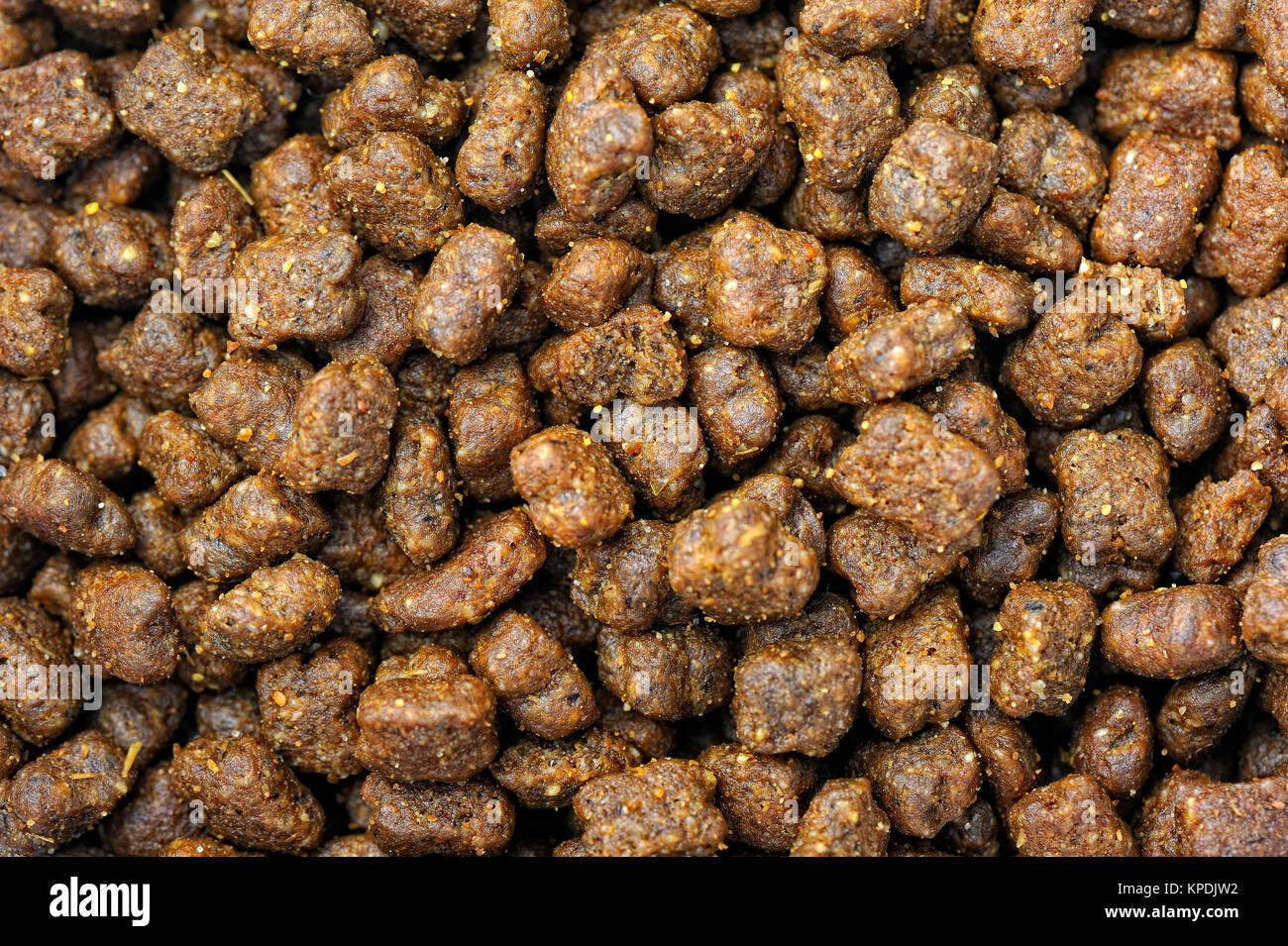 Dry cat food background, shallow DOF Stock Photo - Alamy