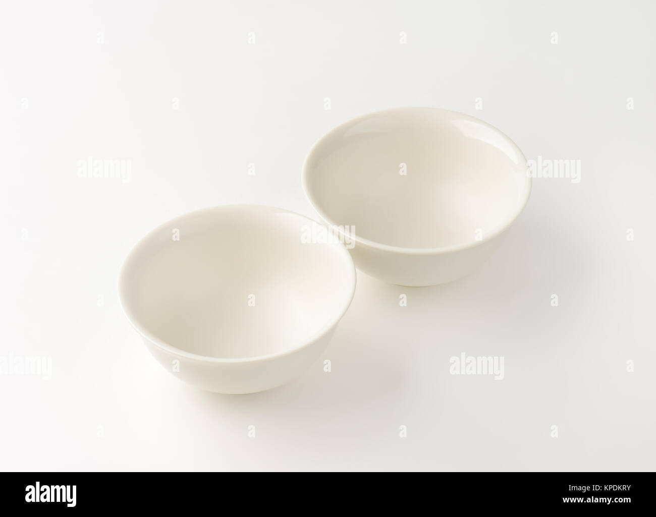 two white bowls Stock Photo - Alamy