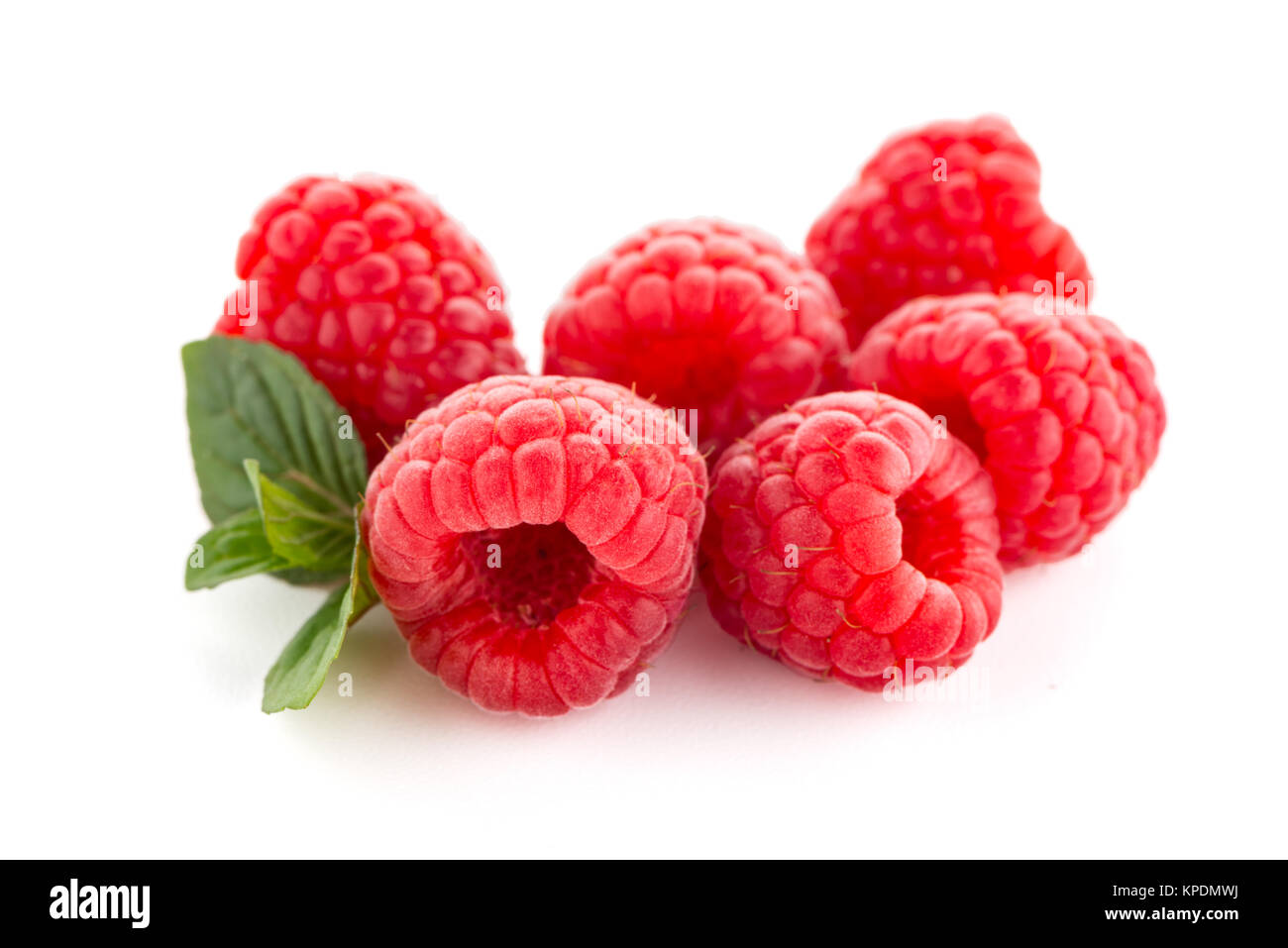 Raspberries with leaves Stock Photo - Alamy