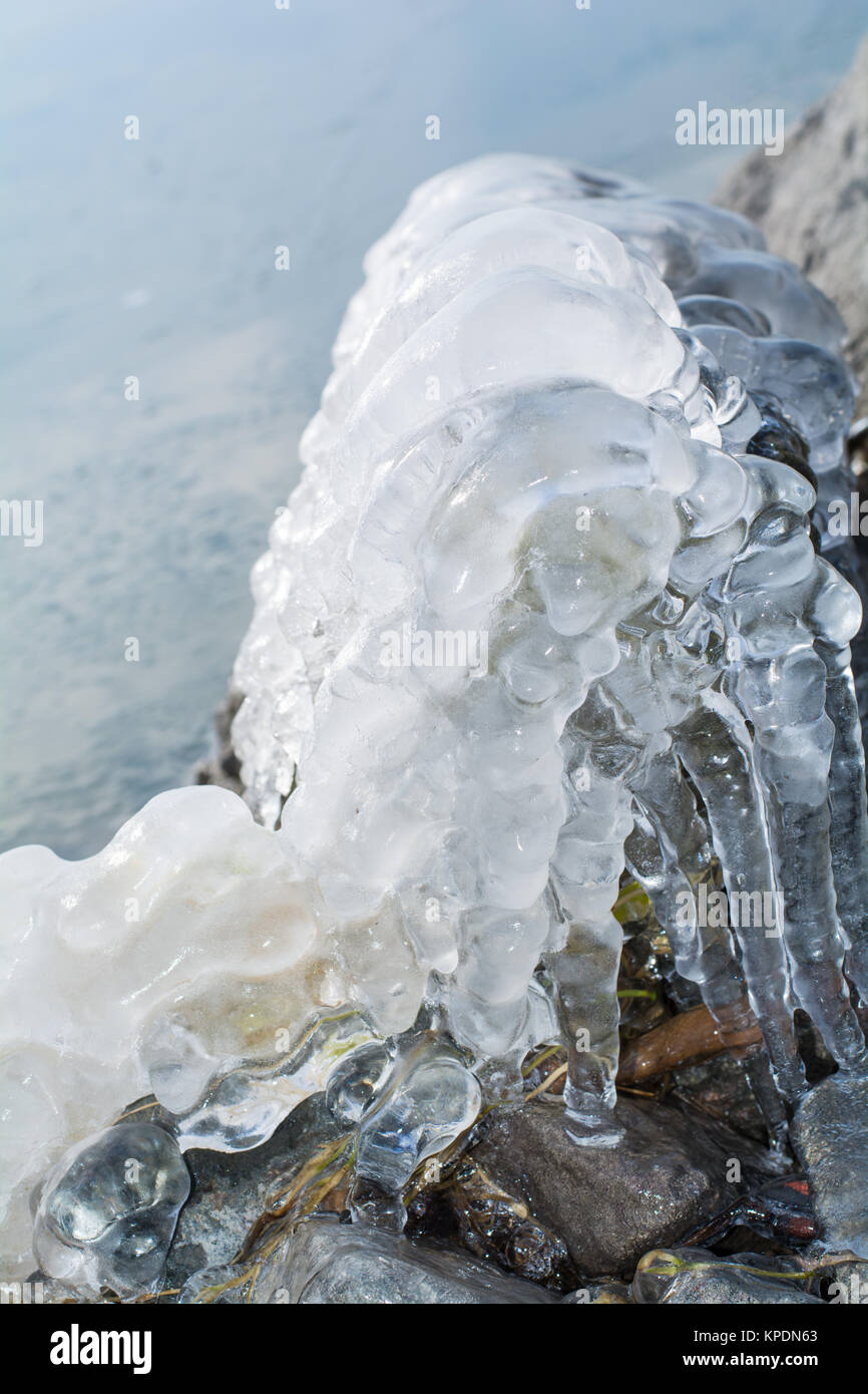 Frozen rocks with ice in the winter lake Stock Photo - Alamy