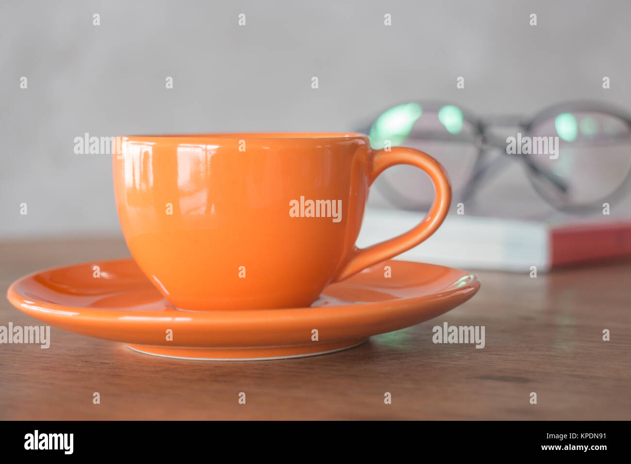 Orange mug cup of coffee Stock Photo - Alamy
