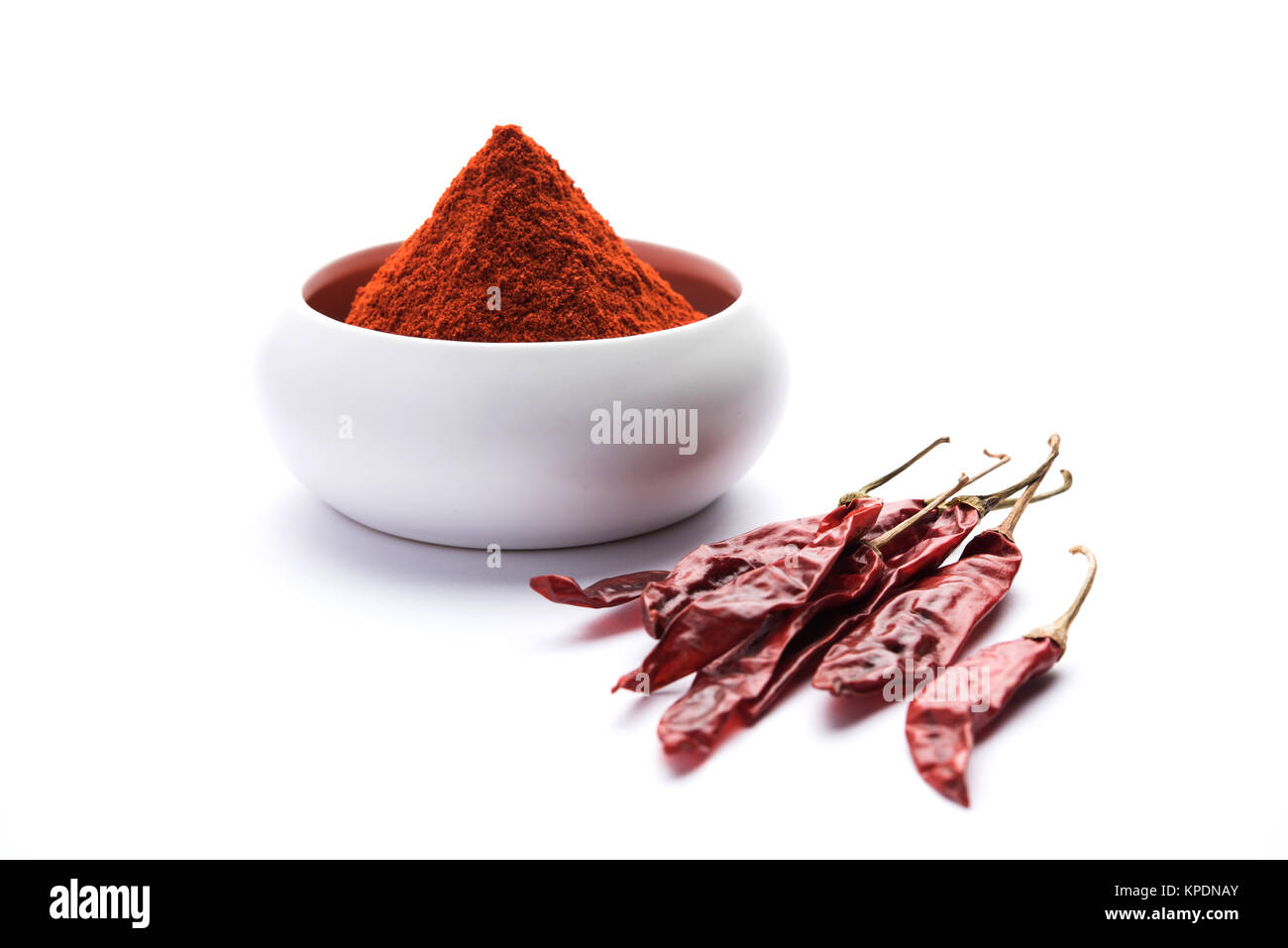 Red Chilly Powder in a bowl with dried red chillies over colourful ...
