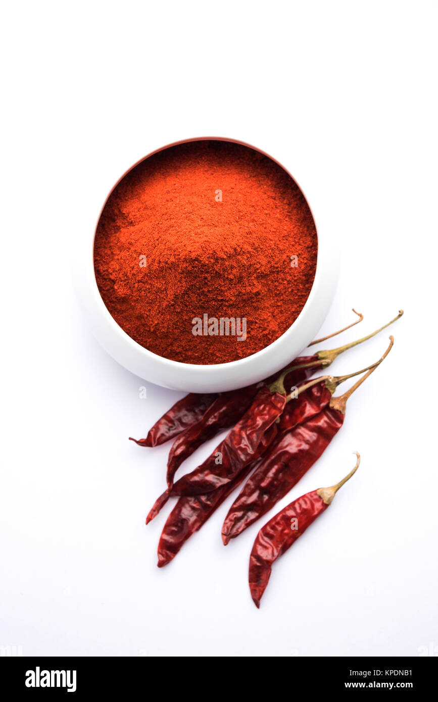 Red Chilly Powder in a bowl with dried red chillies over colourful ...