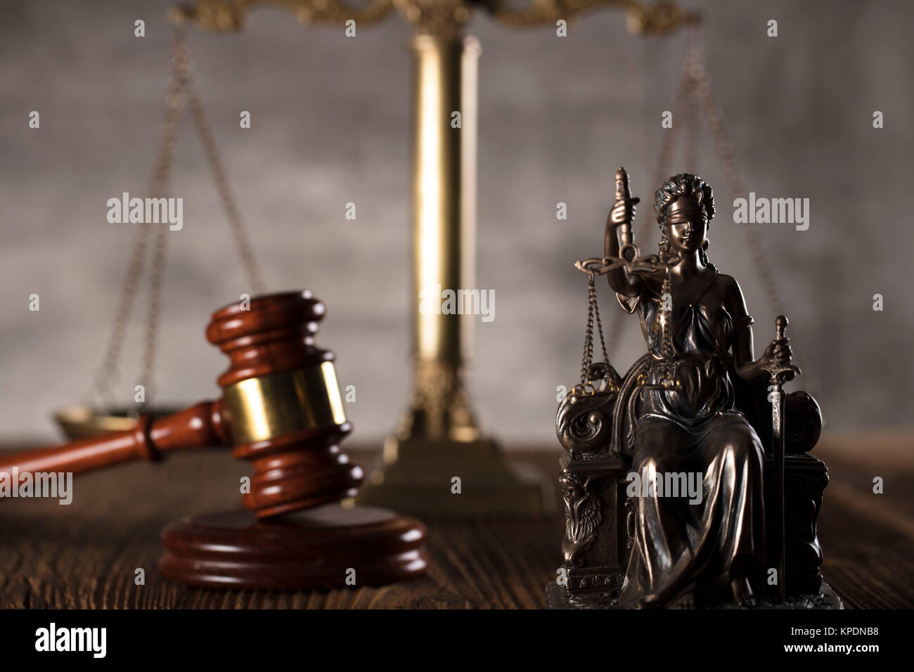 Statue of justice and gavel of the judge on a stone background and ...