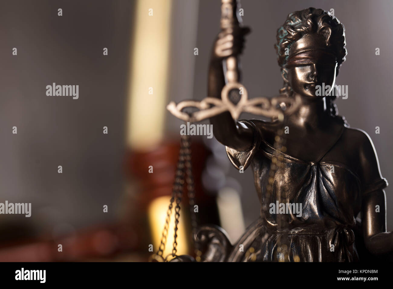 Statue of justice and gavel of the judge on a stone background and ...