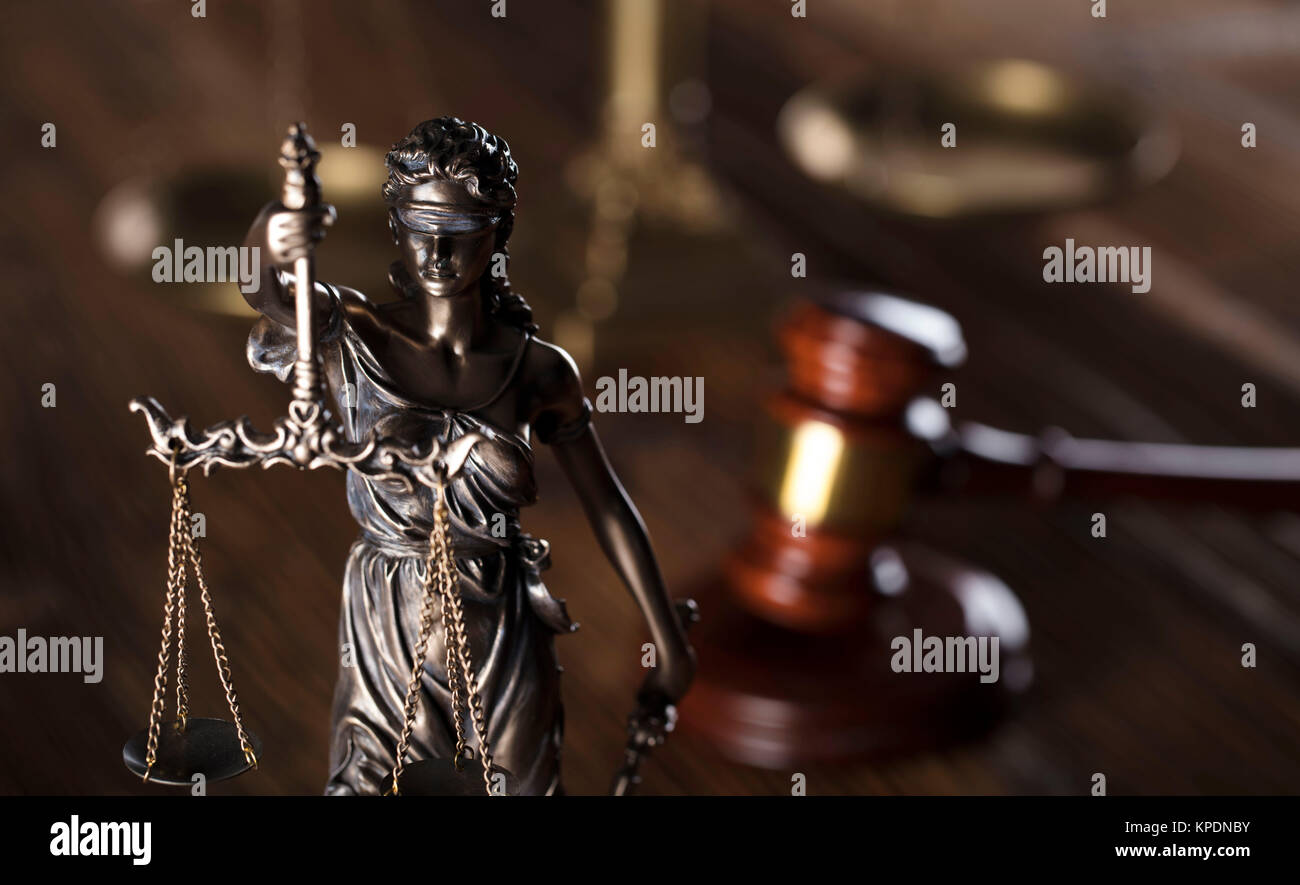 Statue of justice and gavel of the judge on a stone background and ...
