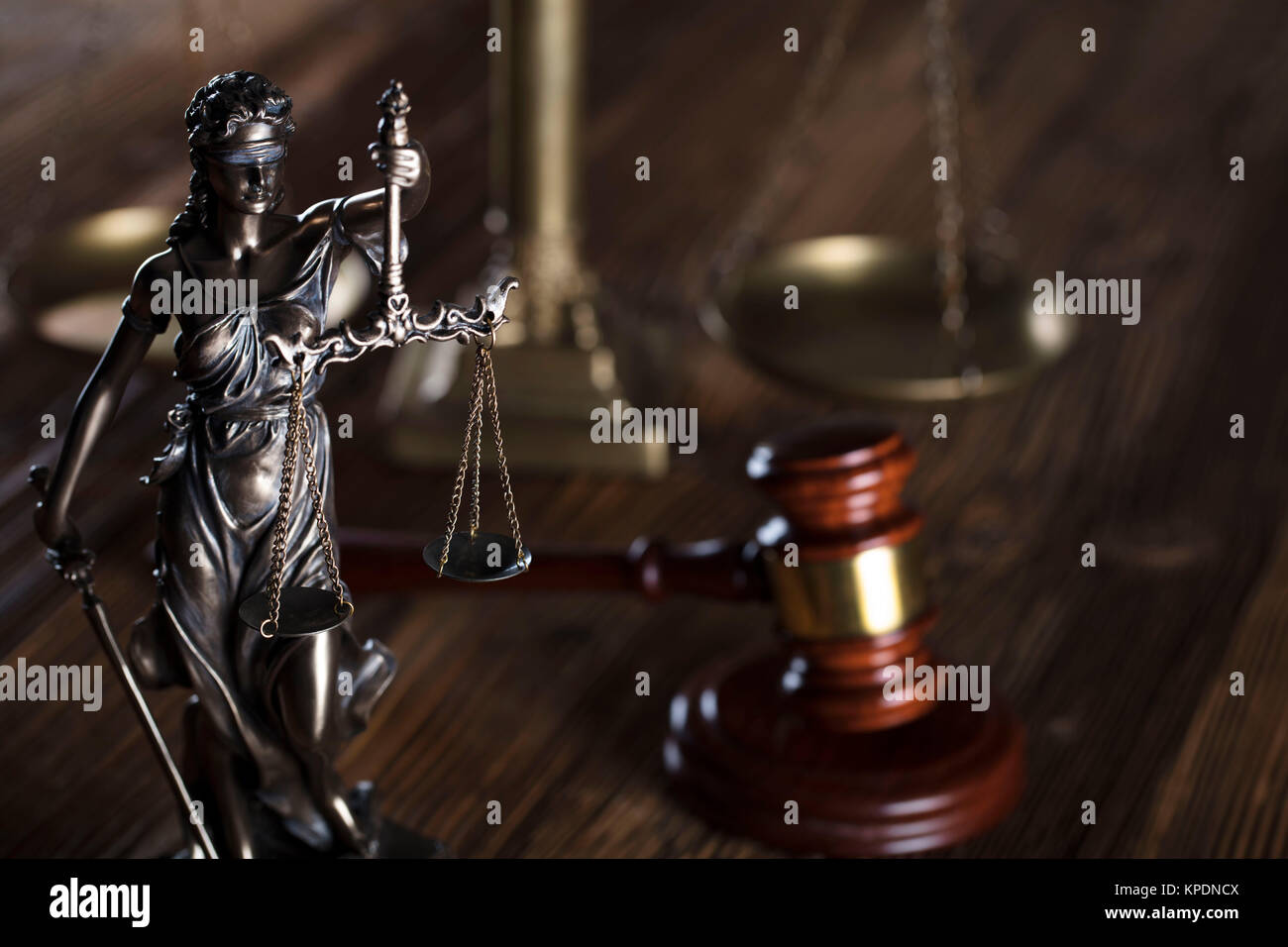 Statue of justice and gavel of the judge on a stone background and ...