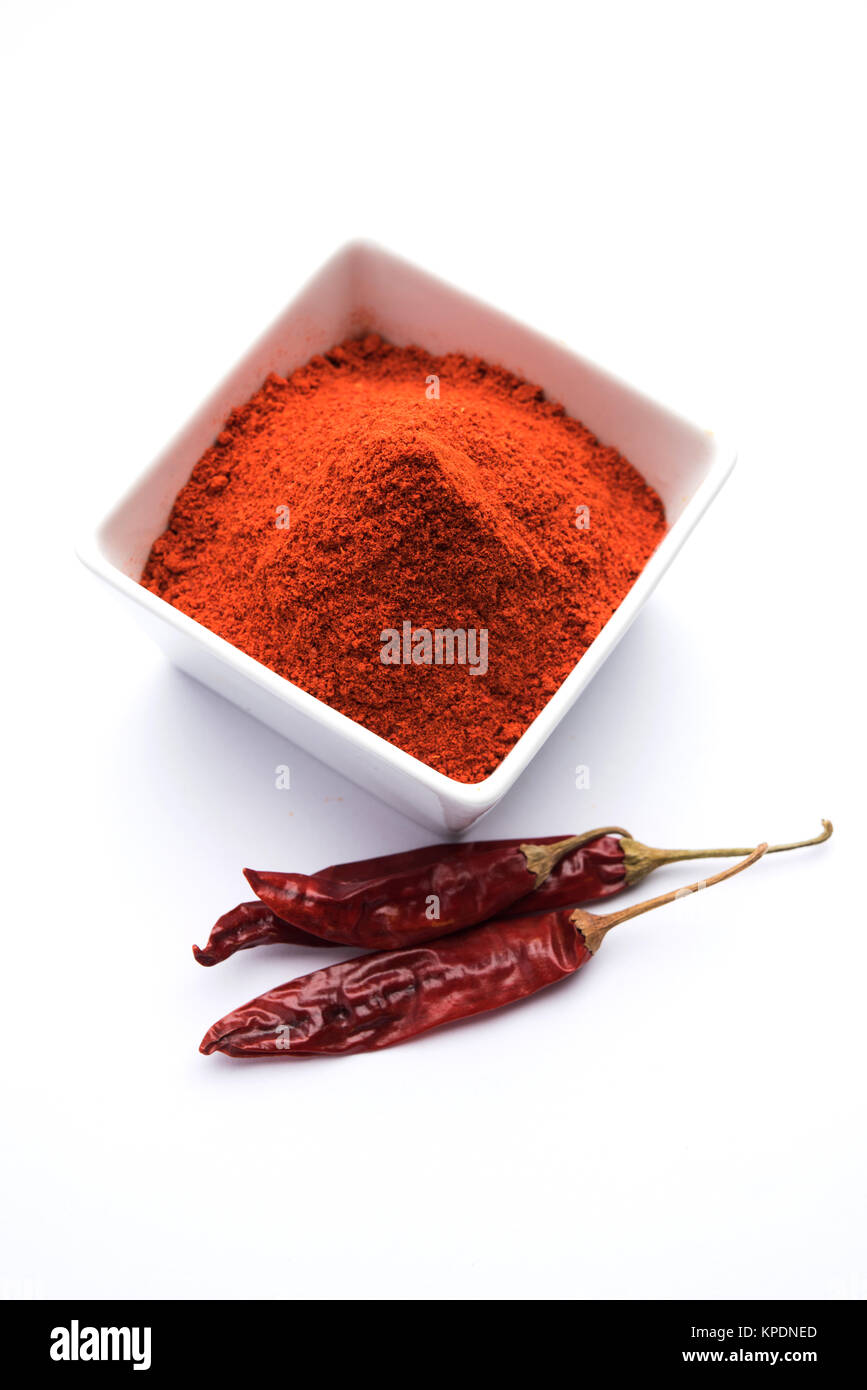 Red Chilly Powder in a bowl with dried red chillies over colourful ...