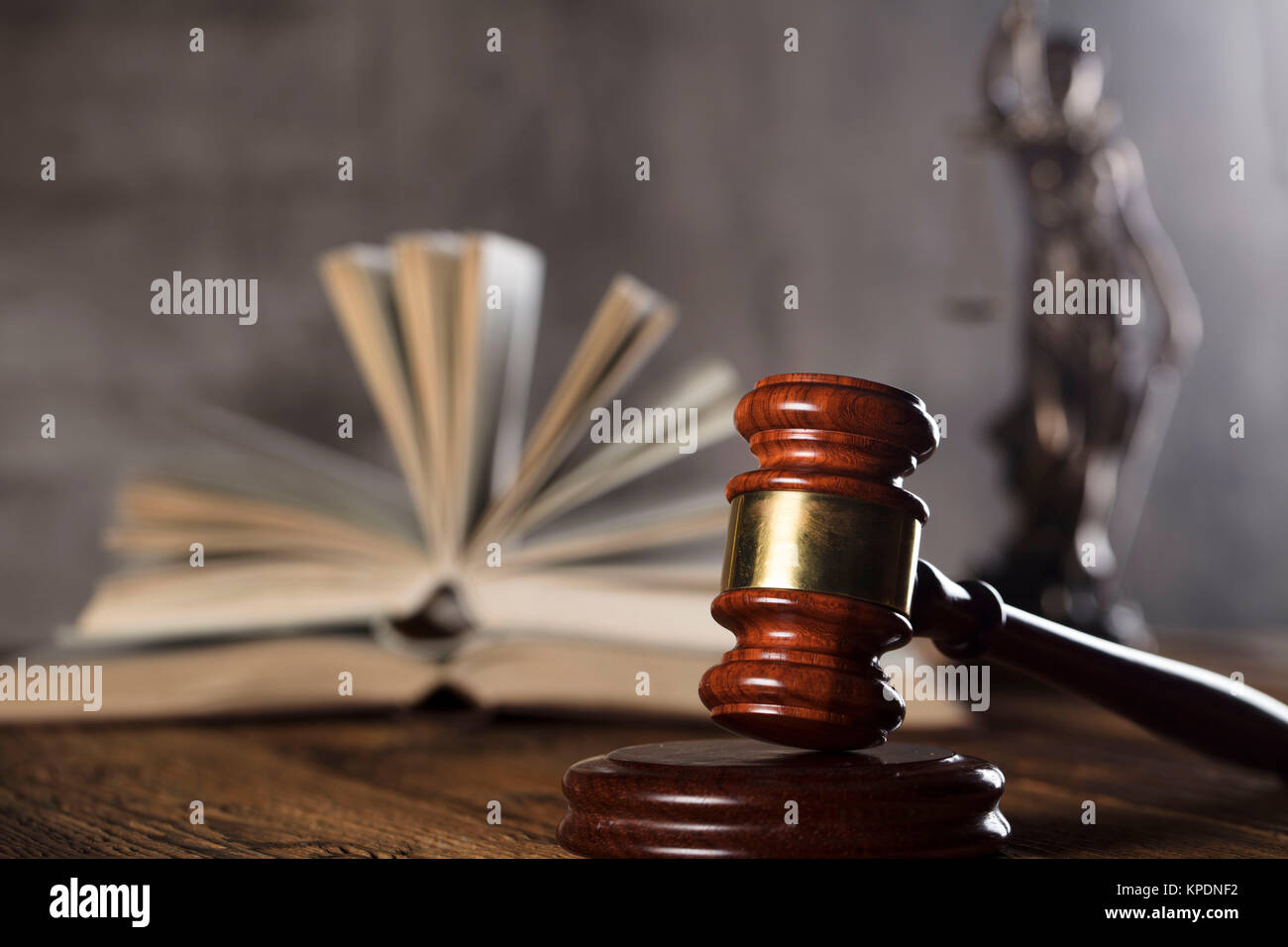 Statue of justice and gavel of the judge on a stone background and ...