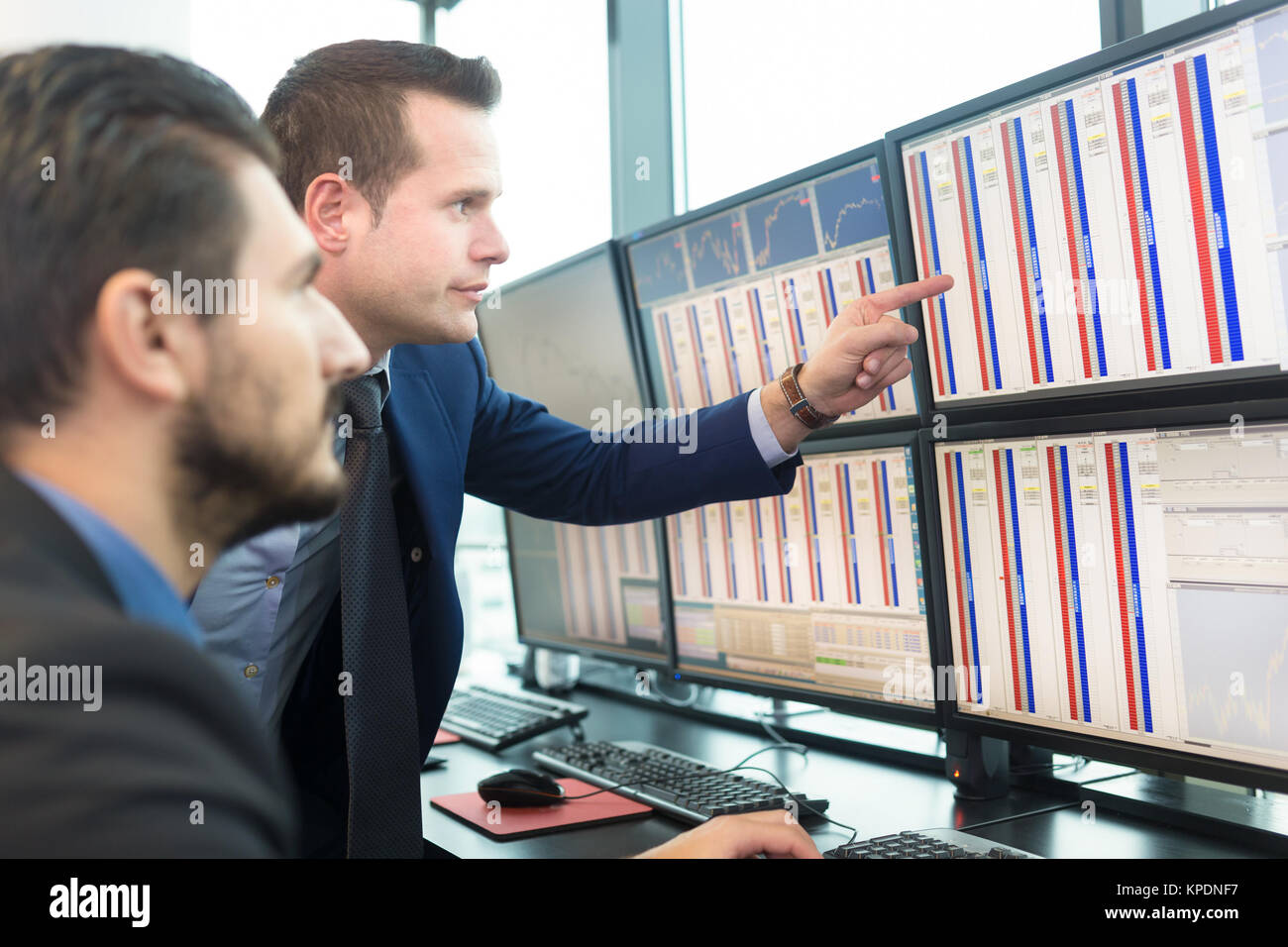 Stock traders looking at computer screens Stock Photo - Alamy