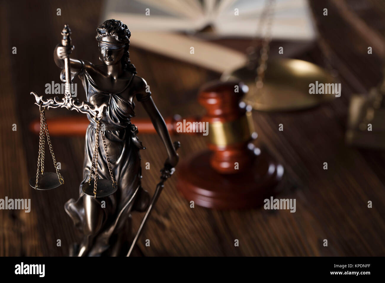 Statue of justice and gavel of the judge on a stone background and ...