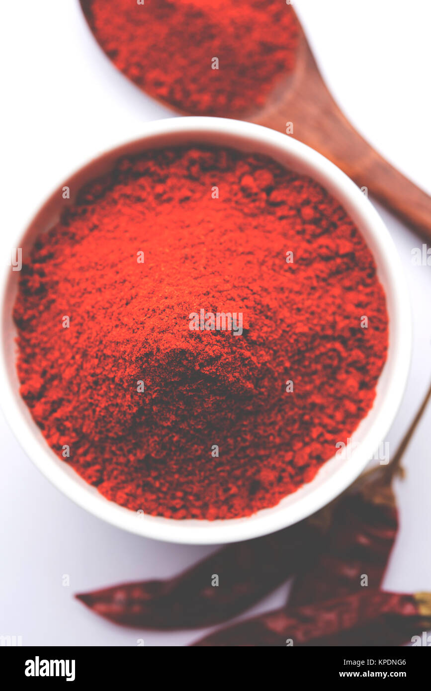 Red Chilly Powder in a bowl with dried red chillies over colourful ...