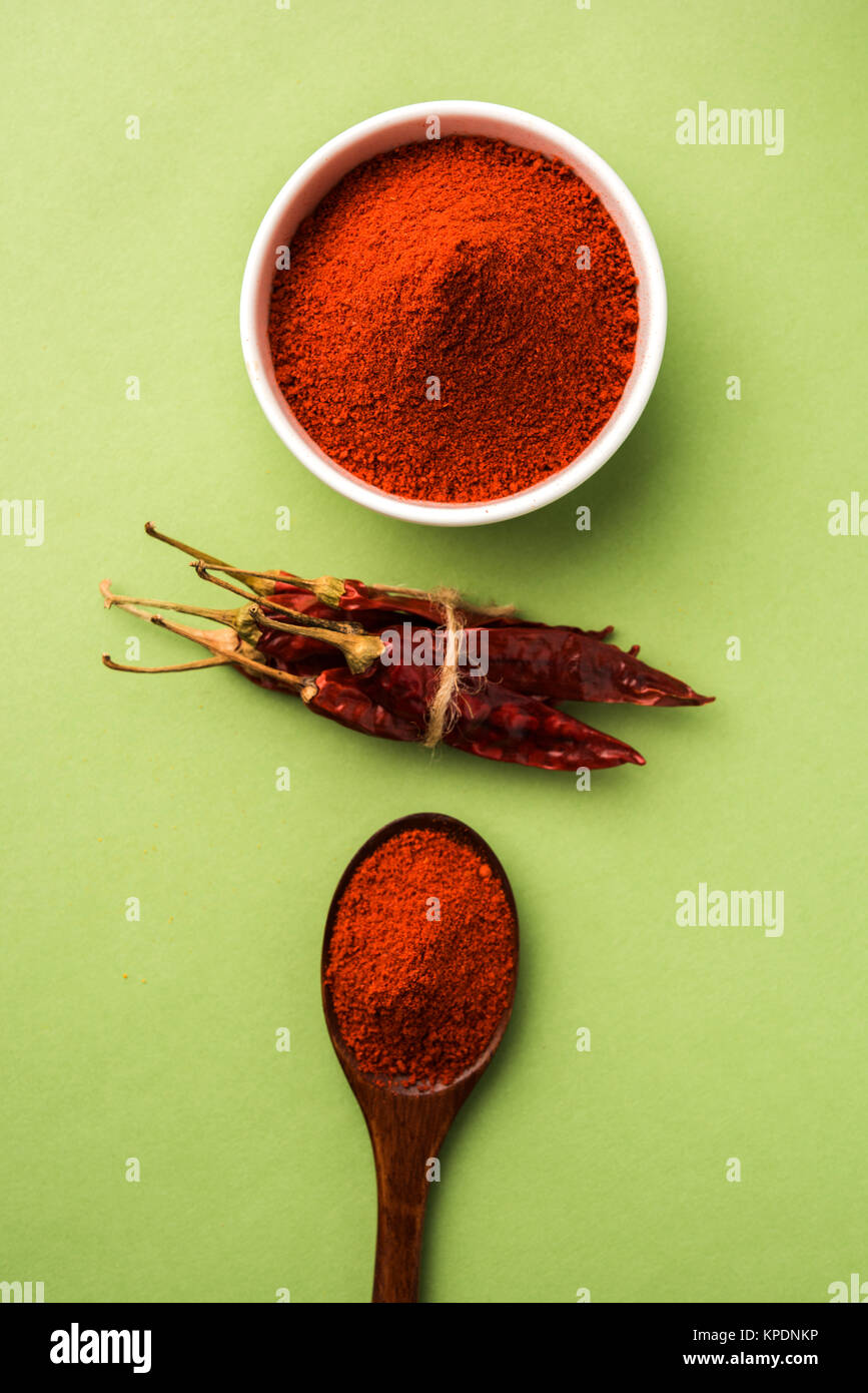 Red Chilly Powder in a bowl with dried red chillies over colourful ...