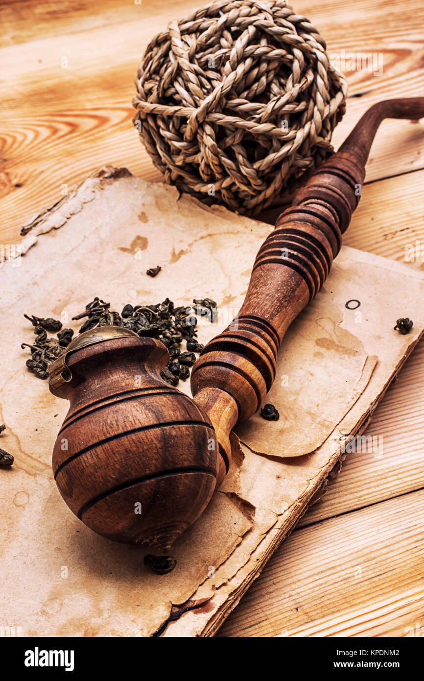 Smoking pipe in a retro style,dark chocolate on wooden background Stock ...