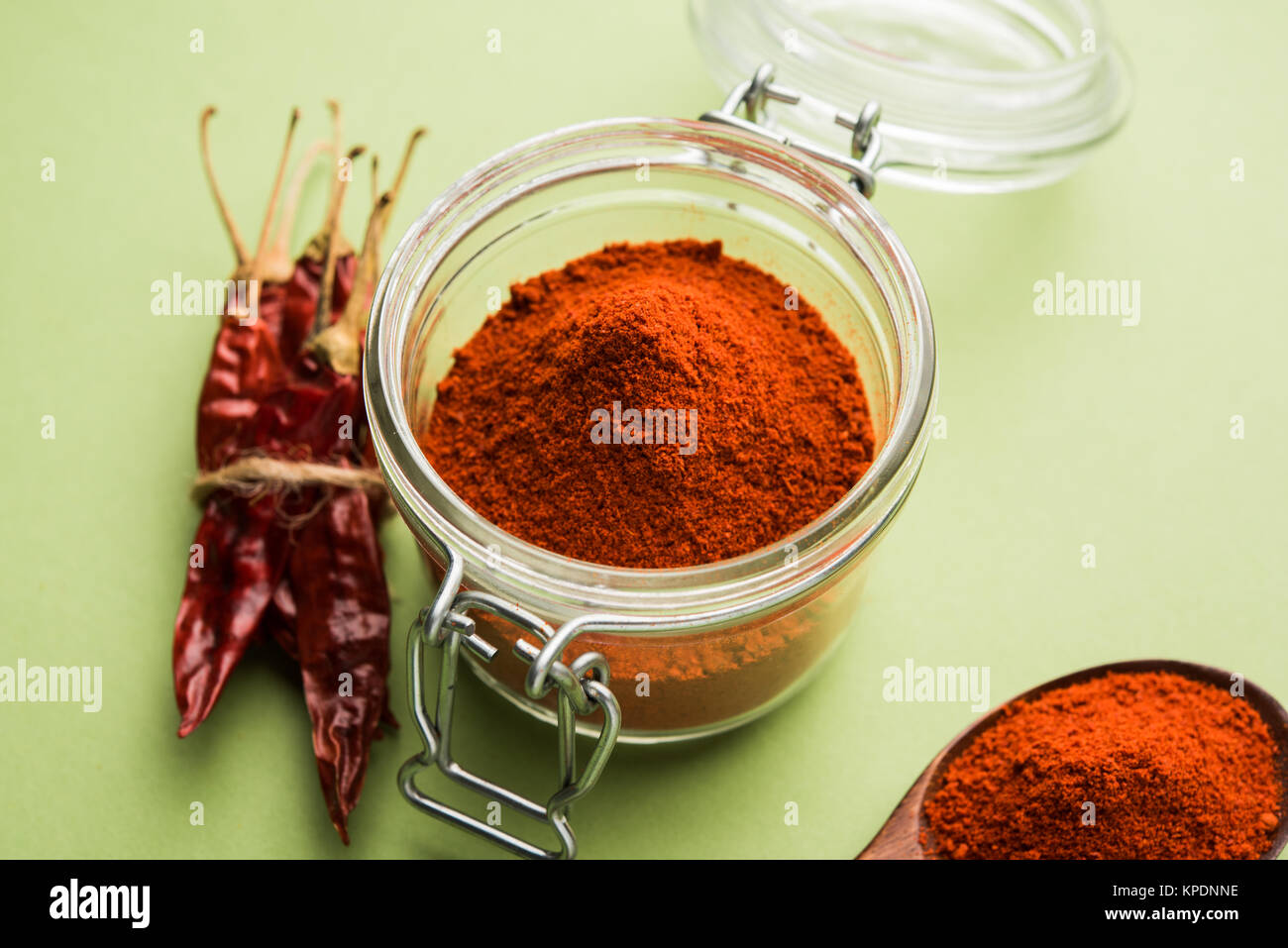 Red Chilly Powder in a bowl with dried red chillies over colourful ...