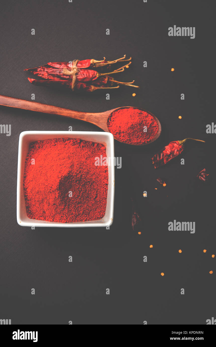 Red Chilly Powder in a bowl with dried red chillies over colourful ...