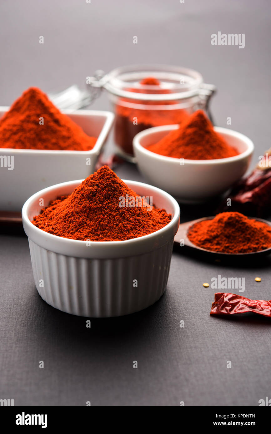 Red Chilly Powder in a bowl with dried red chillies over colourful ...