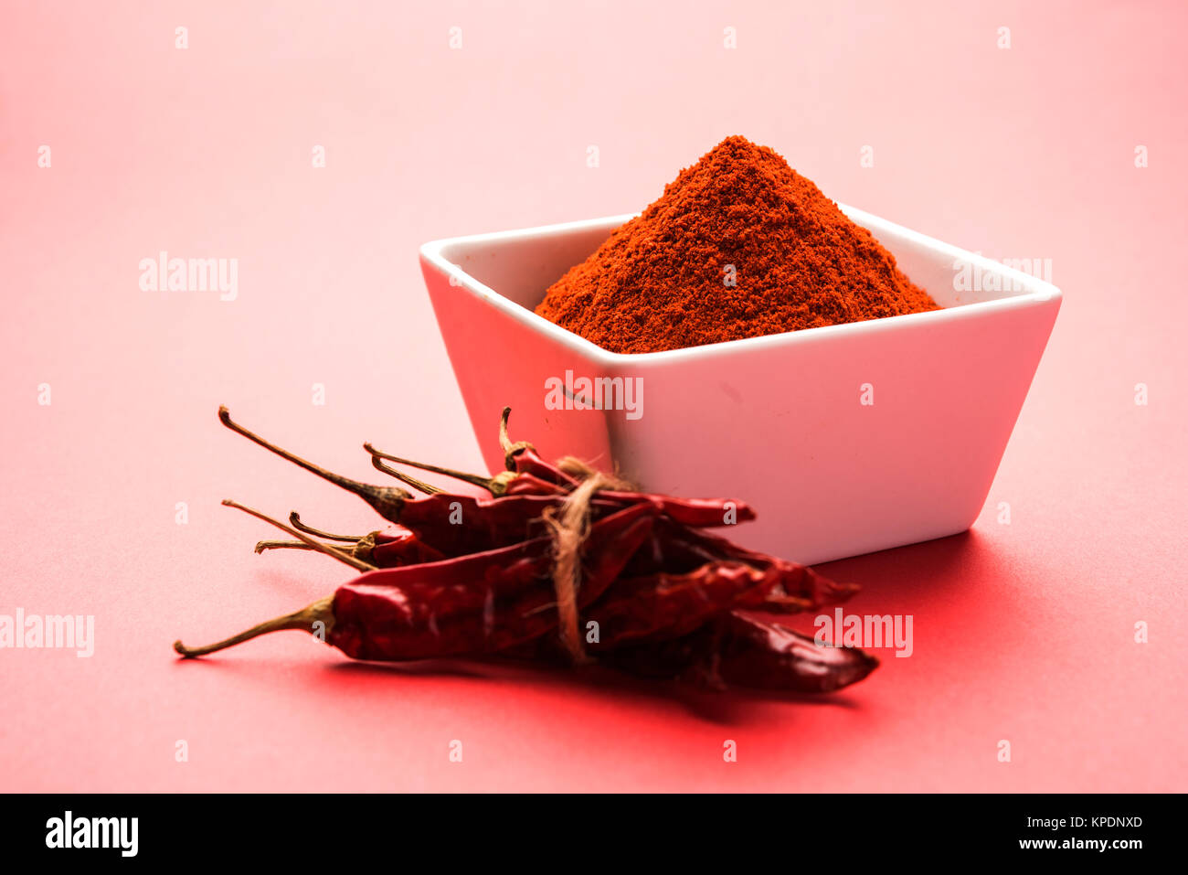 Red Chilly Powder in a bowl with dried red chillies over colourful ...