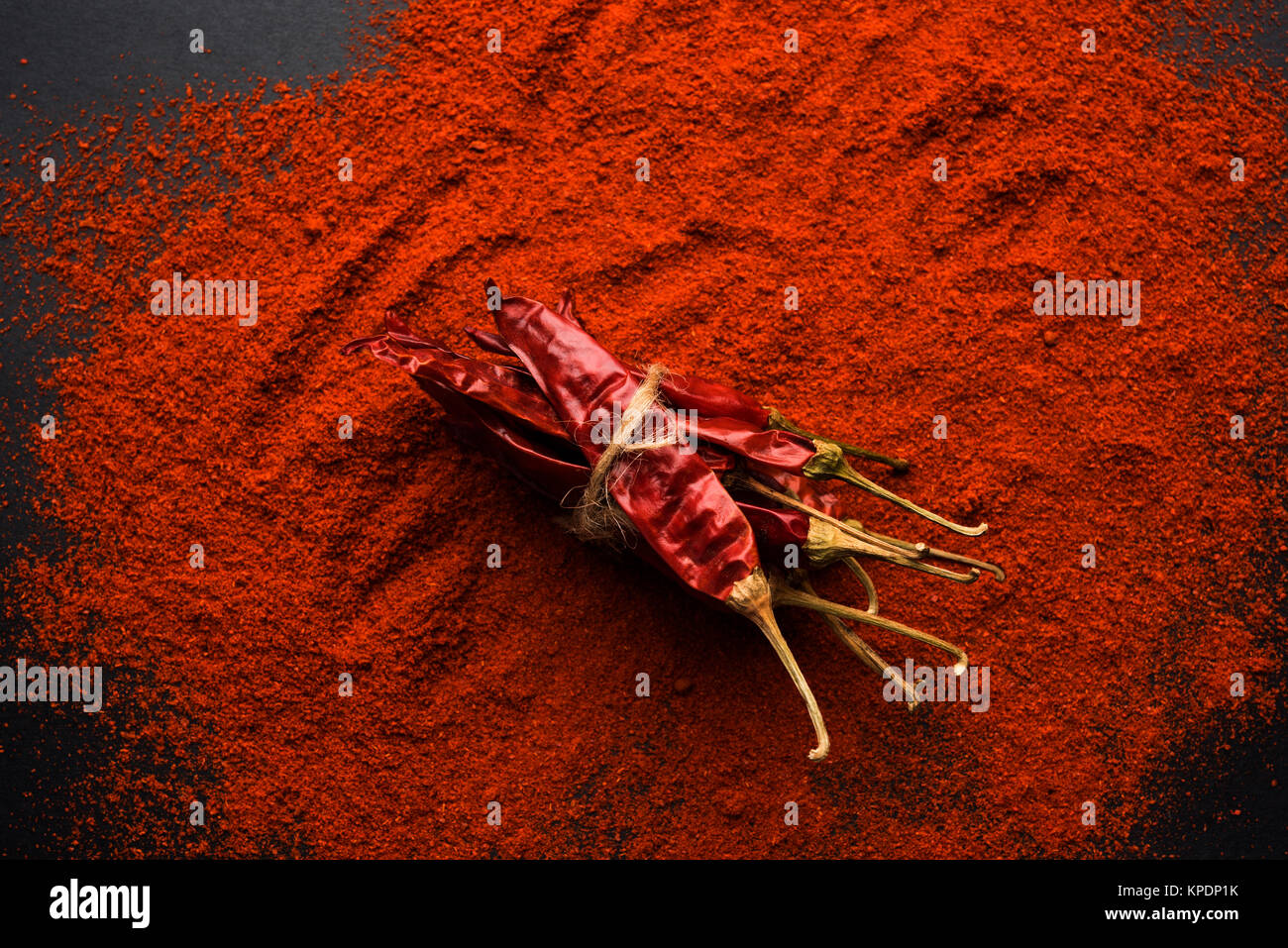 Red Chilly Powder in a bowl with dried red chillies over colourful ...
