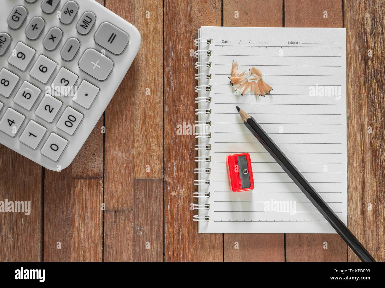 Paper note with pencil and calculator Stock Photo - Alamy