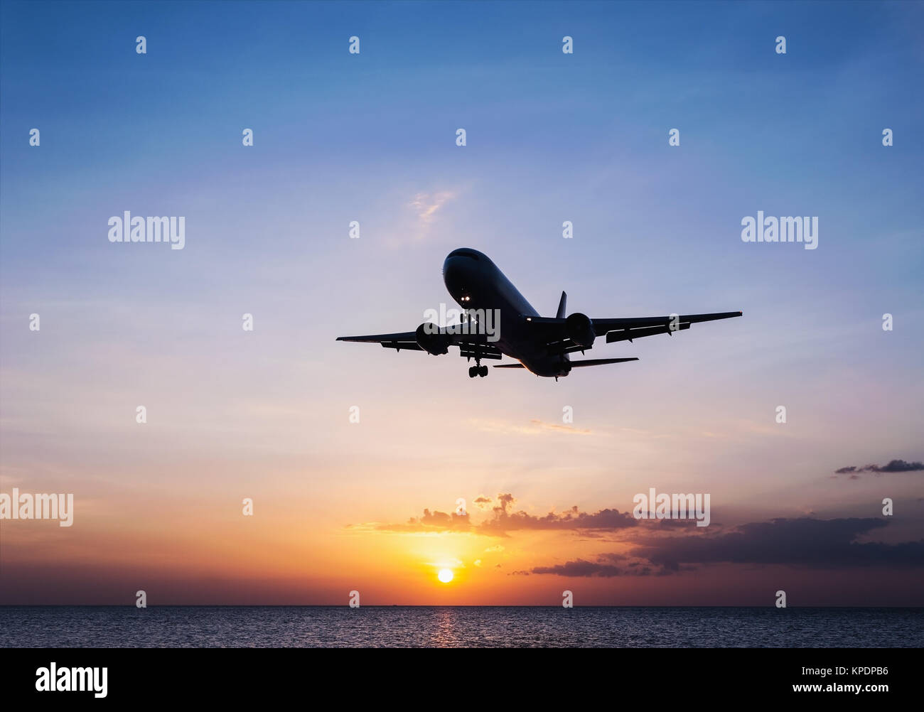 Plane with sky sunset and sea Stock Photo - Alamy