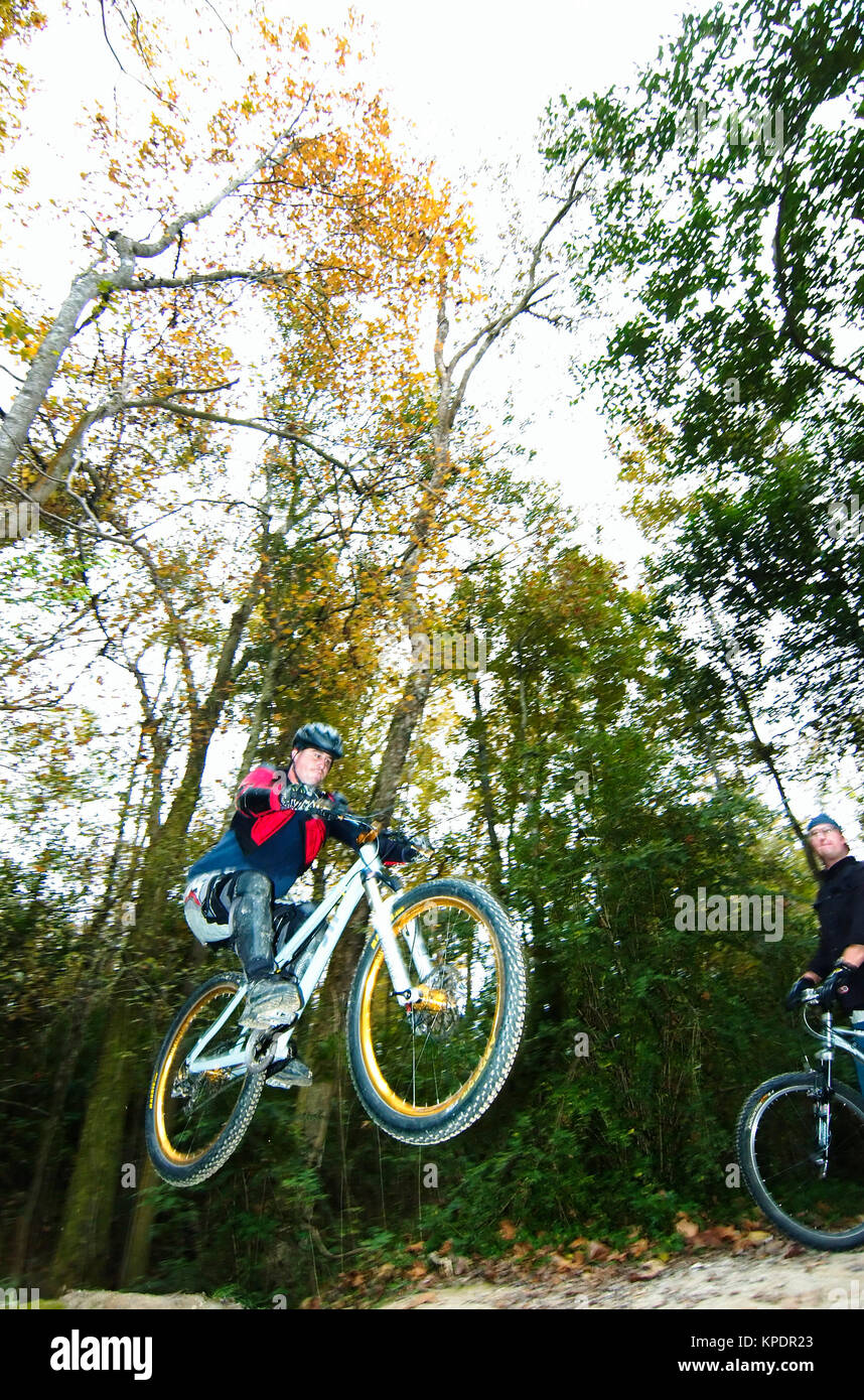 Baton Rouge, Louisiana - 2017: A man jumps on his mountain bike on a ...