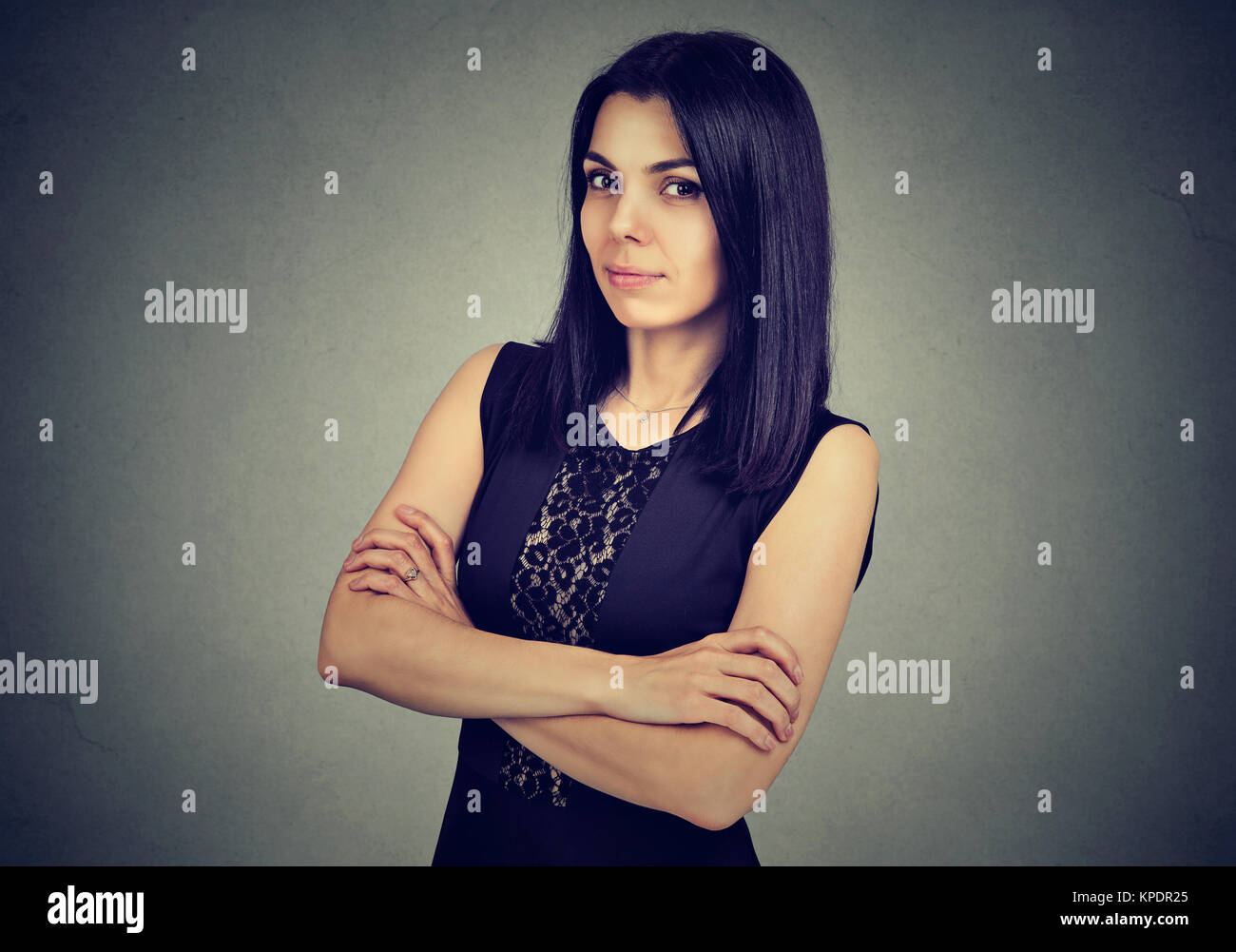 Portrait of a serious young woman looking at camera Stock Photo - Alamy