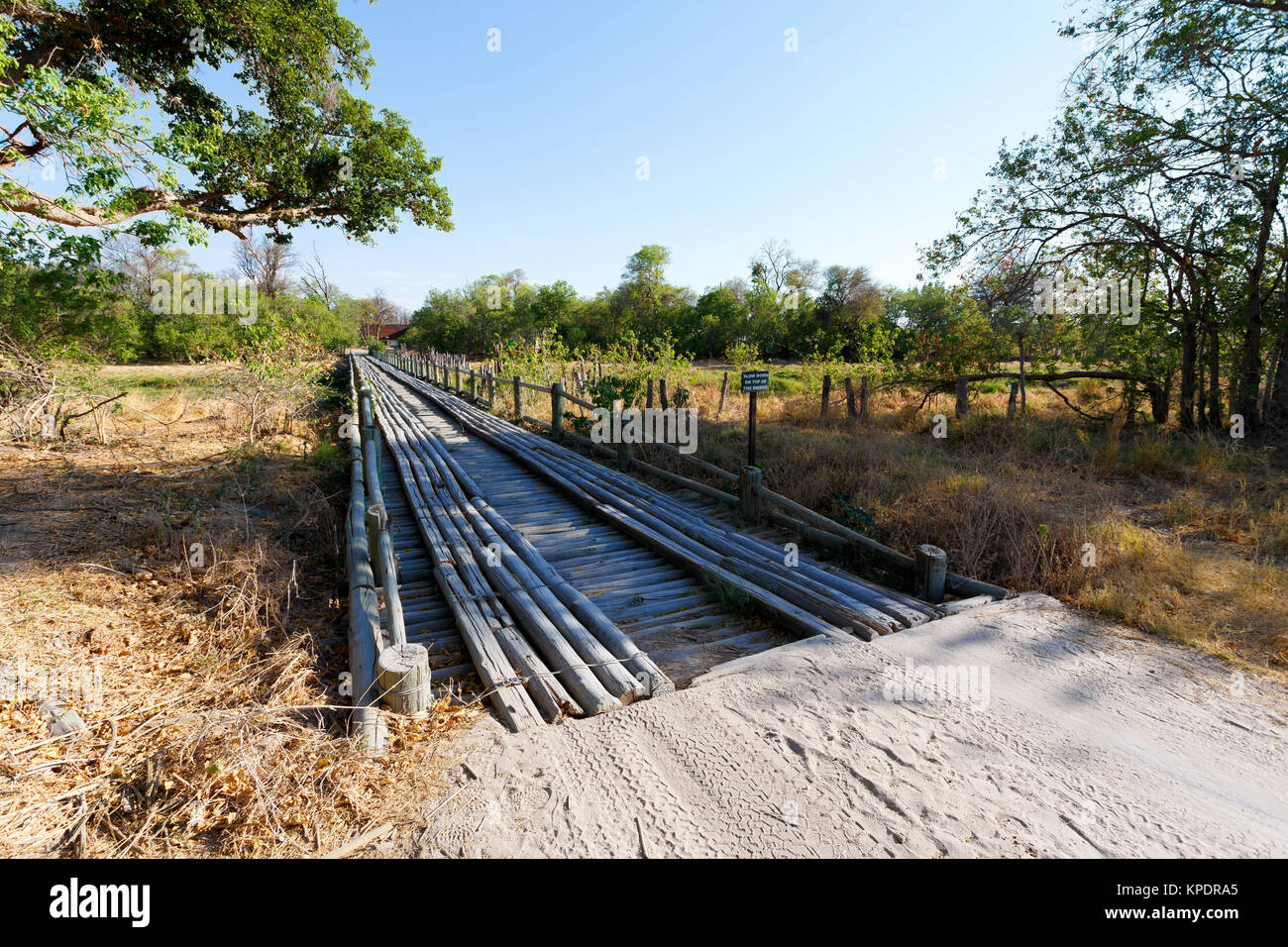 wooden bridge over Okavango swamps Stock Photo - Alamy