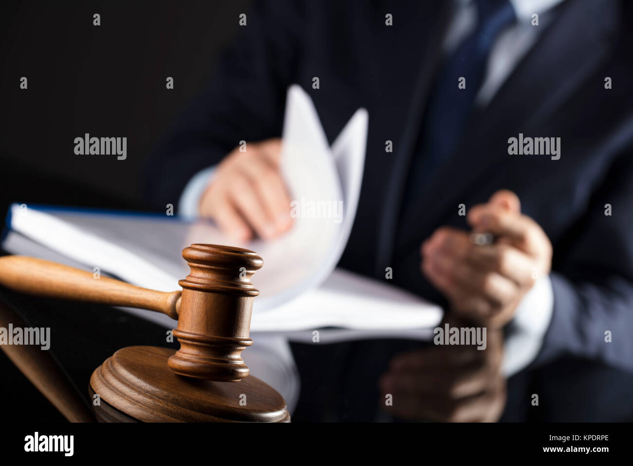 Judge signs the documents. Gavel on a glass table. Law and justice ...
