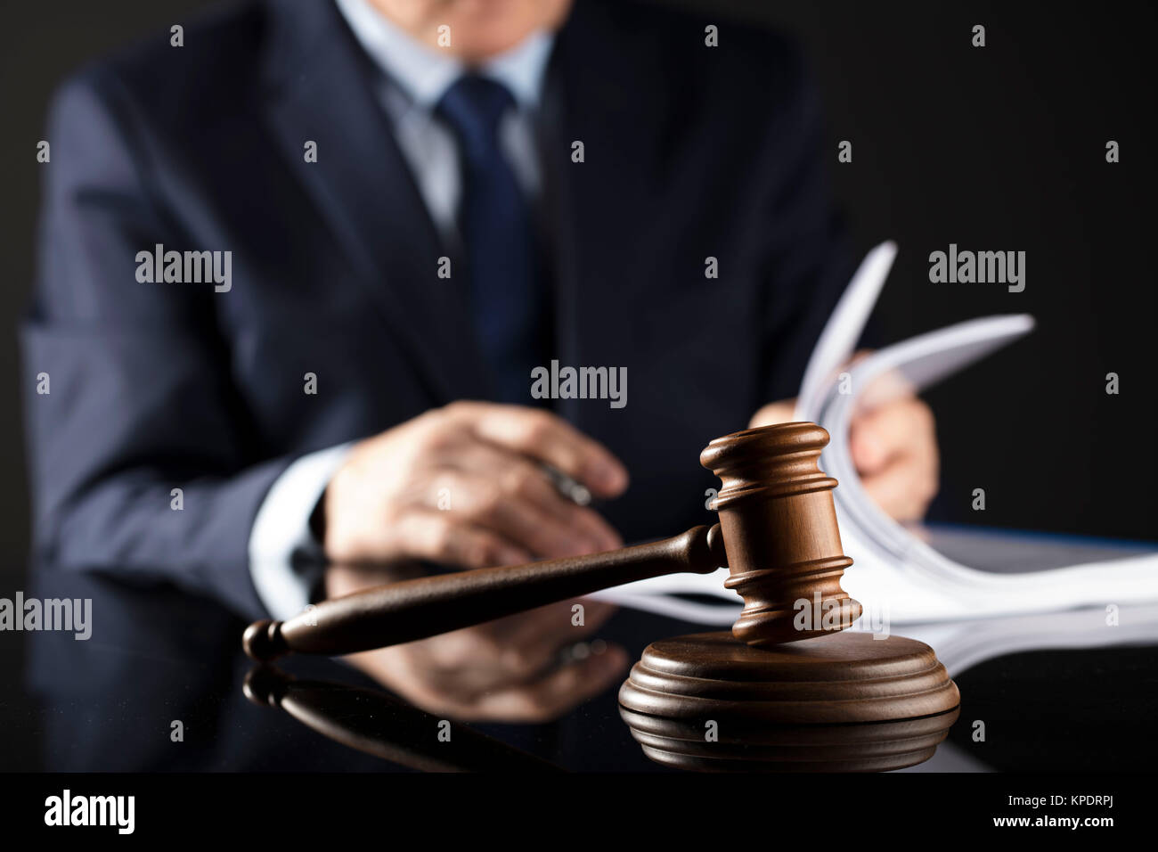 Judge signs the documents. Gavel on a glass table. Law and justice ...