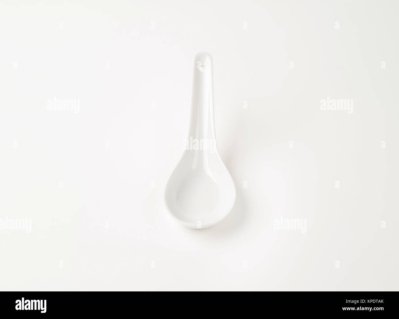 White porcelain appetizer spoon Stock Photo - Alamy
