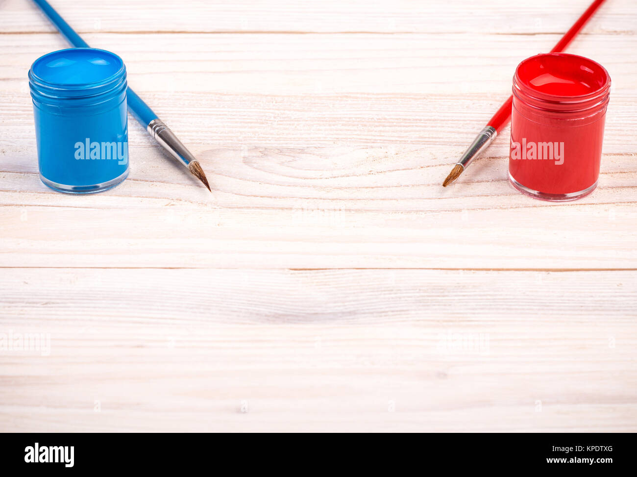 Blue red paints with brushes Stock Photo - Alamy