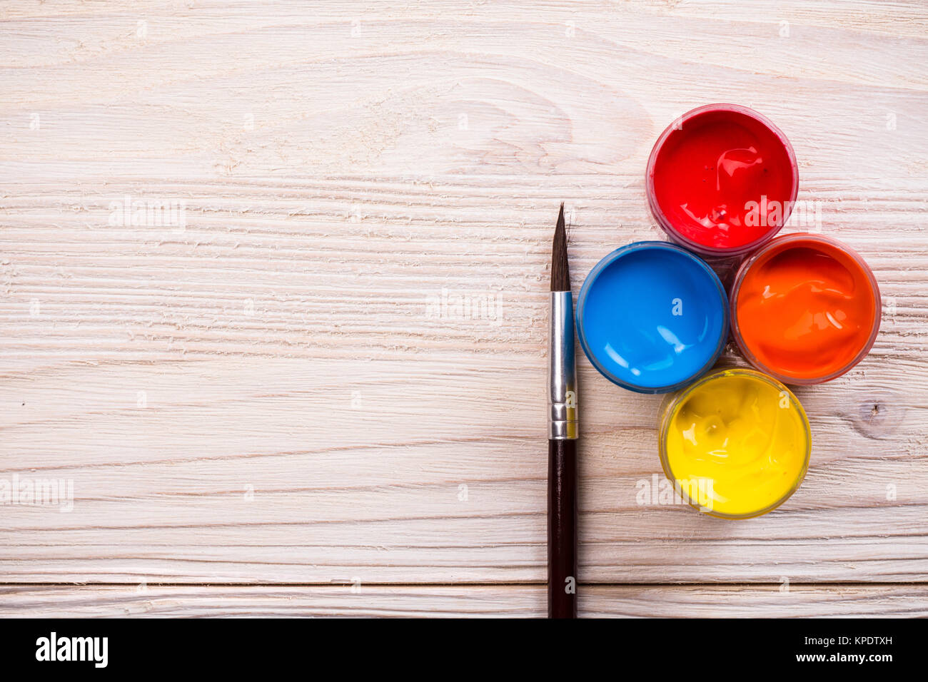 Various color paints with brown brush Stock Photo - Alamy