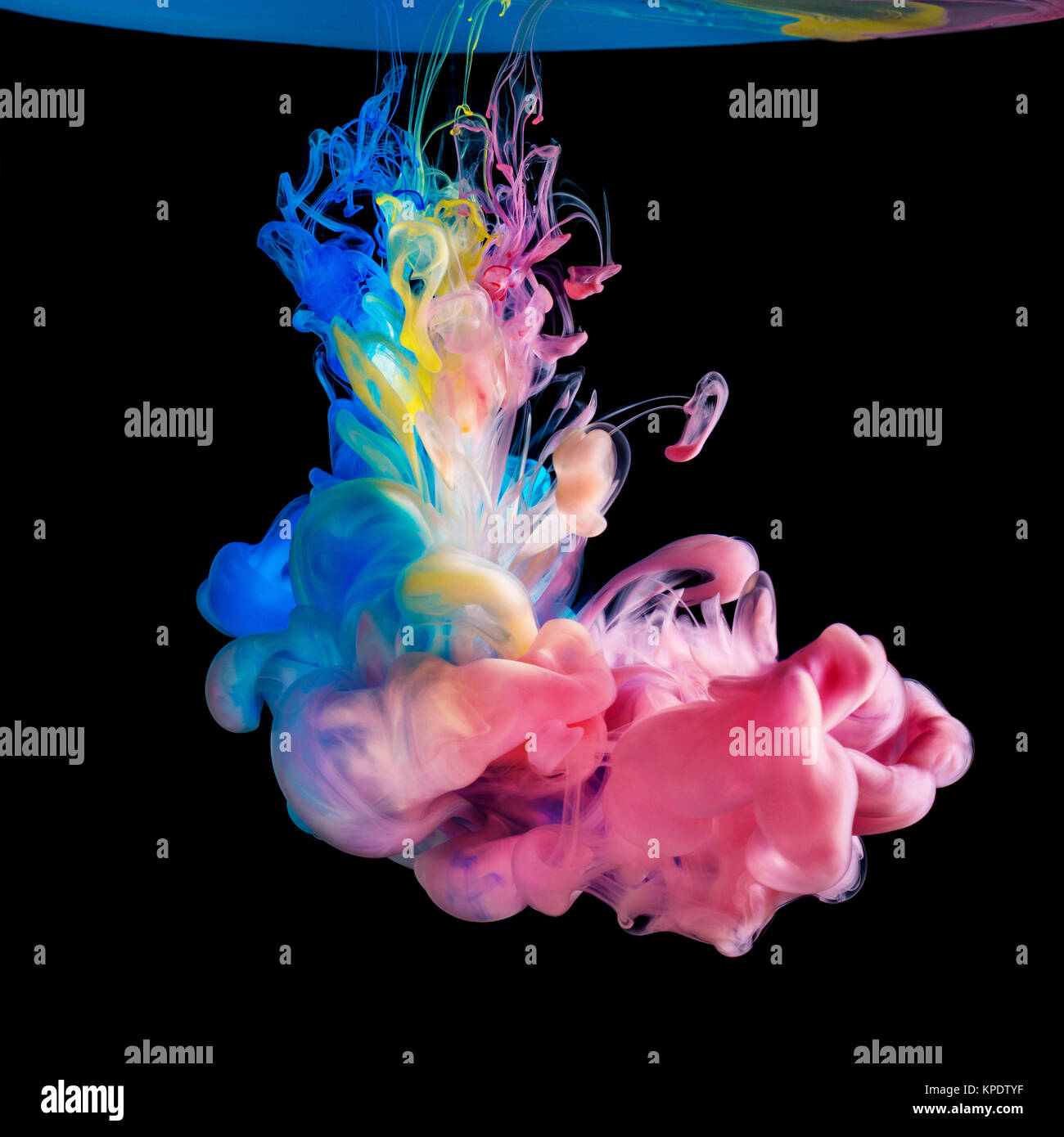 Colored inks in water on black background Stock Photo - Alamy