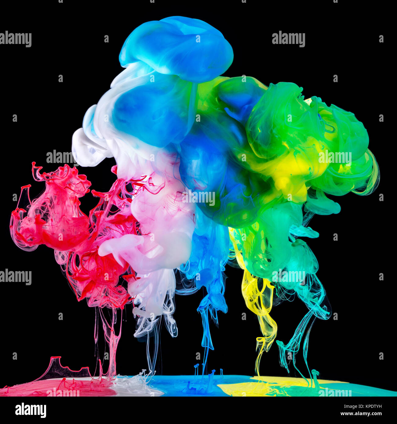 Colored inks in water on black background Stock Photo - Alamy