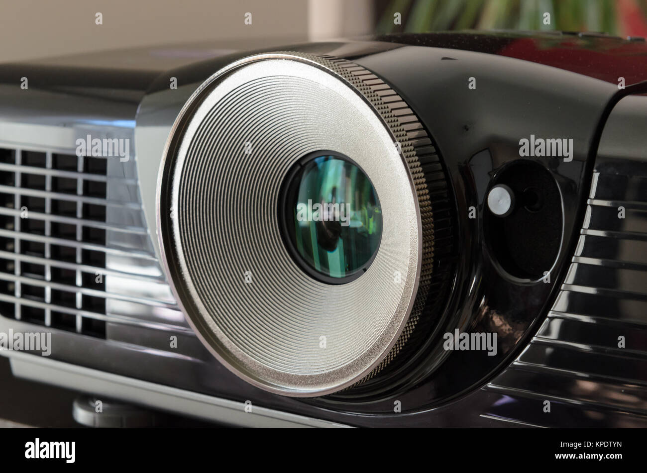 Close up on the huge lens of a black home cinema projector Stock Photo ...