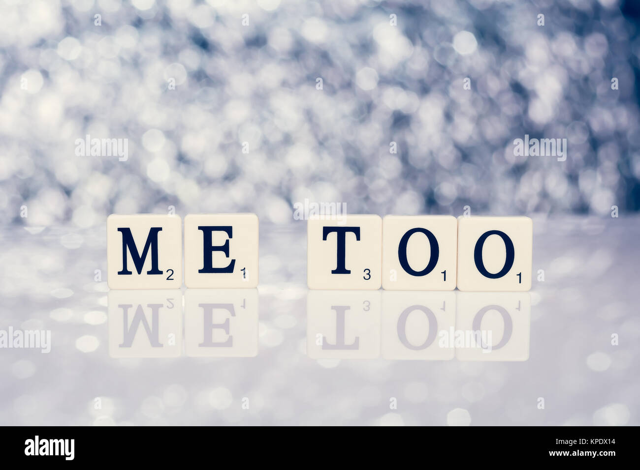 Written word tiles with letters from the game Scrabble - me too Stock ...