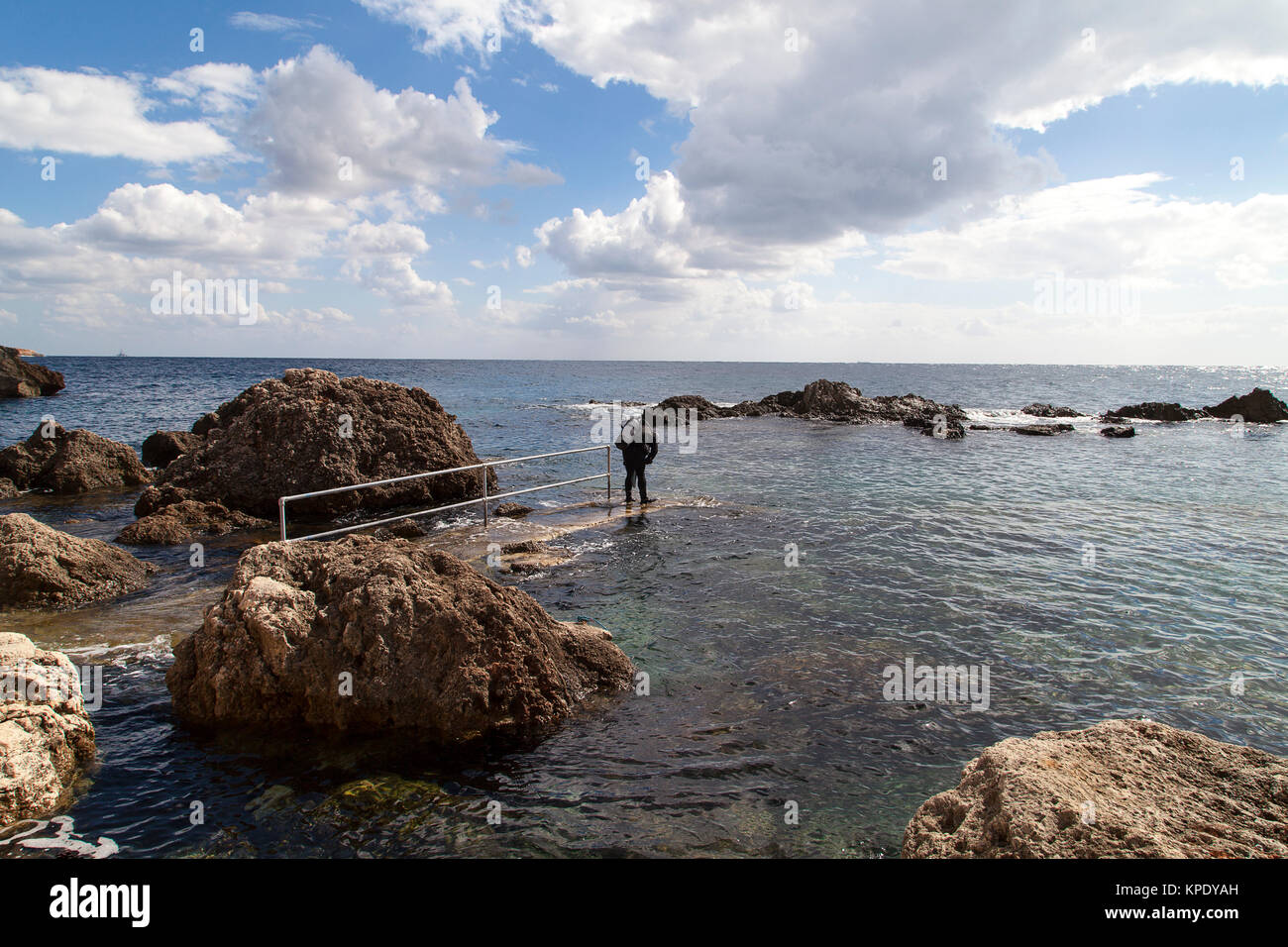 view of sea and diver preparing to dive Stock Photo - Alamy
