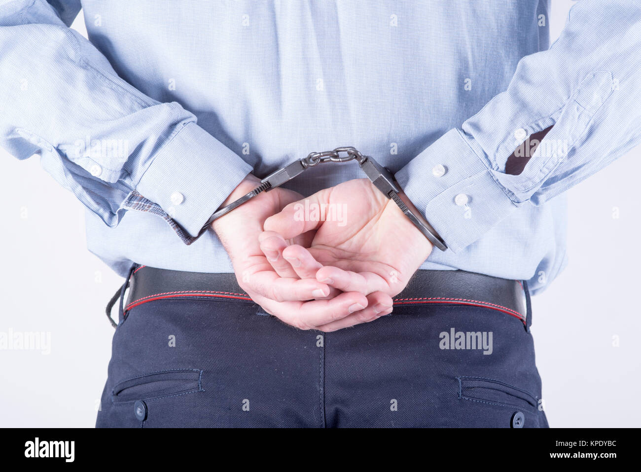 elegant businessman in handcuffs Stock Photo - Alamy