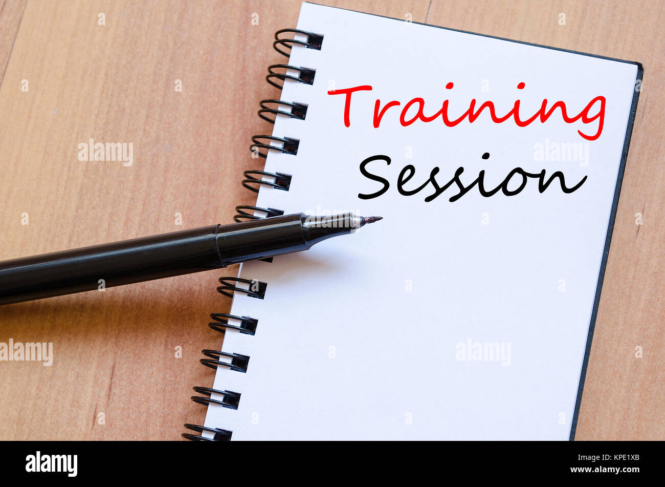 Training session write on notebook Stock Photo - Alamy