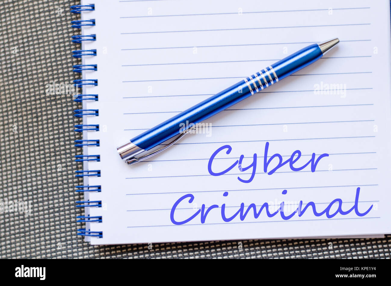 Cyber criminal write on notebook Stock Photo - Alamy